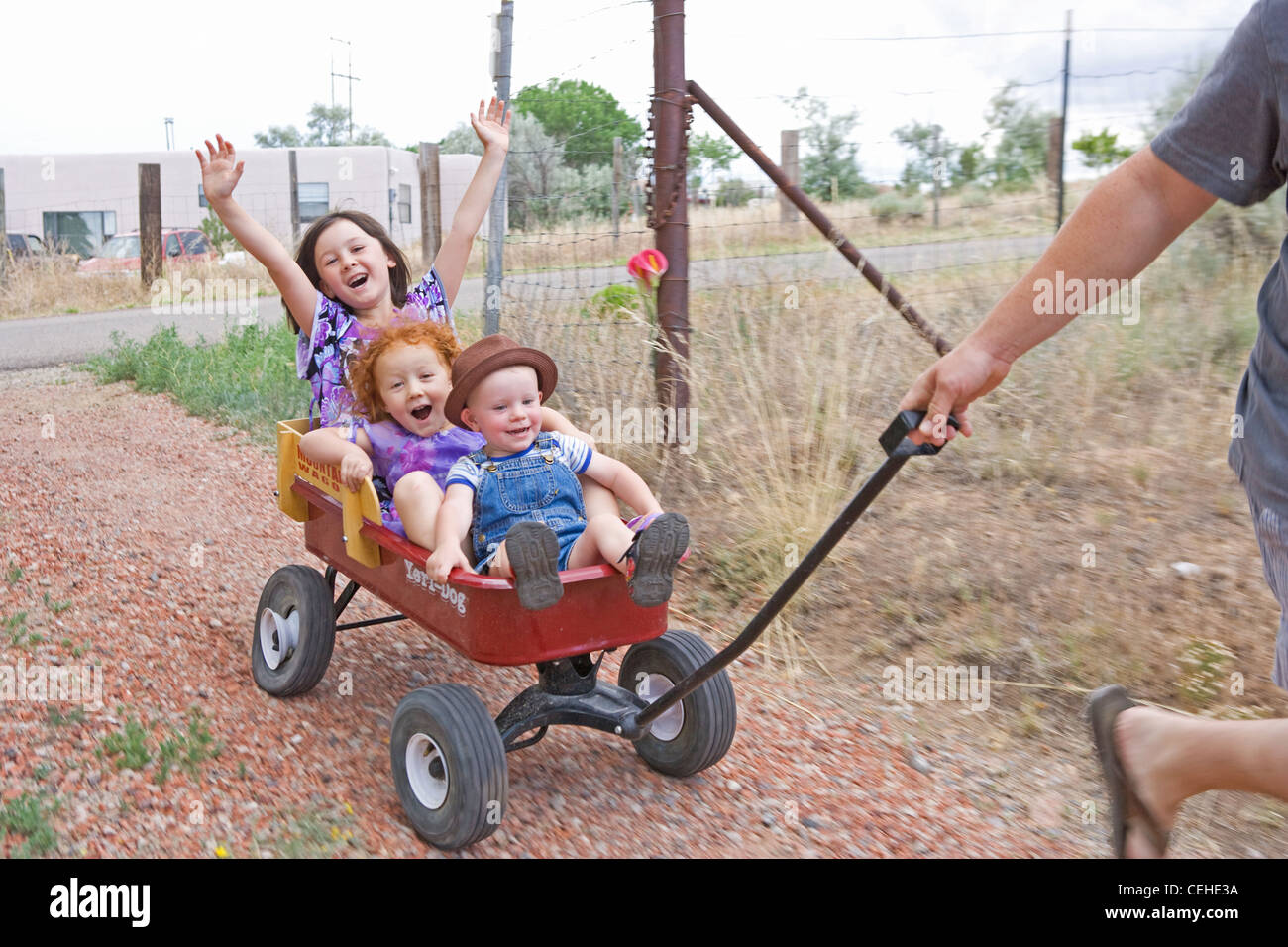 Children being pulled in wagon hi-res stock photography and images - Alamy