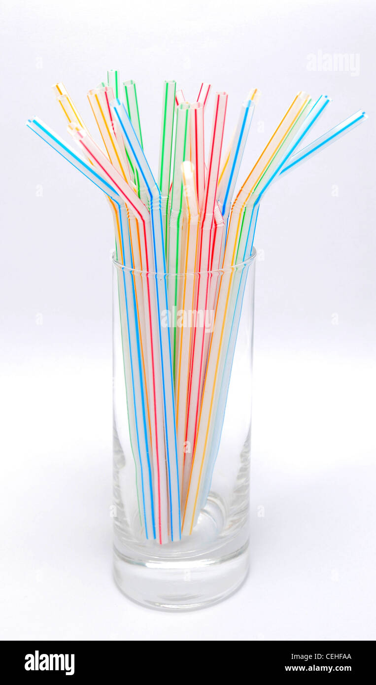 Color straw in glass isolated on the white background Stock Photo - Alamy