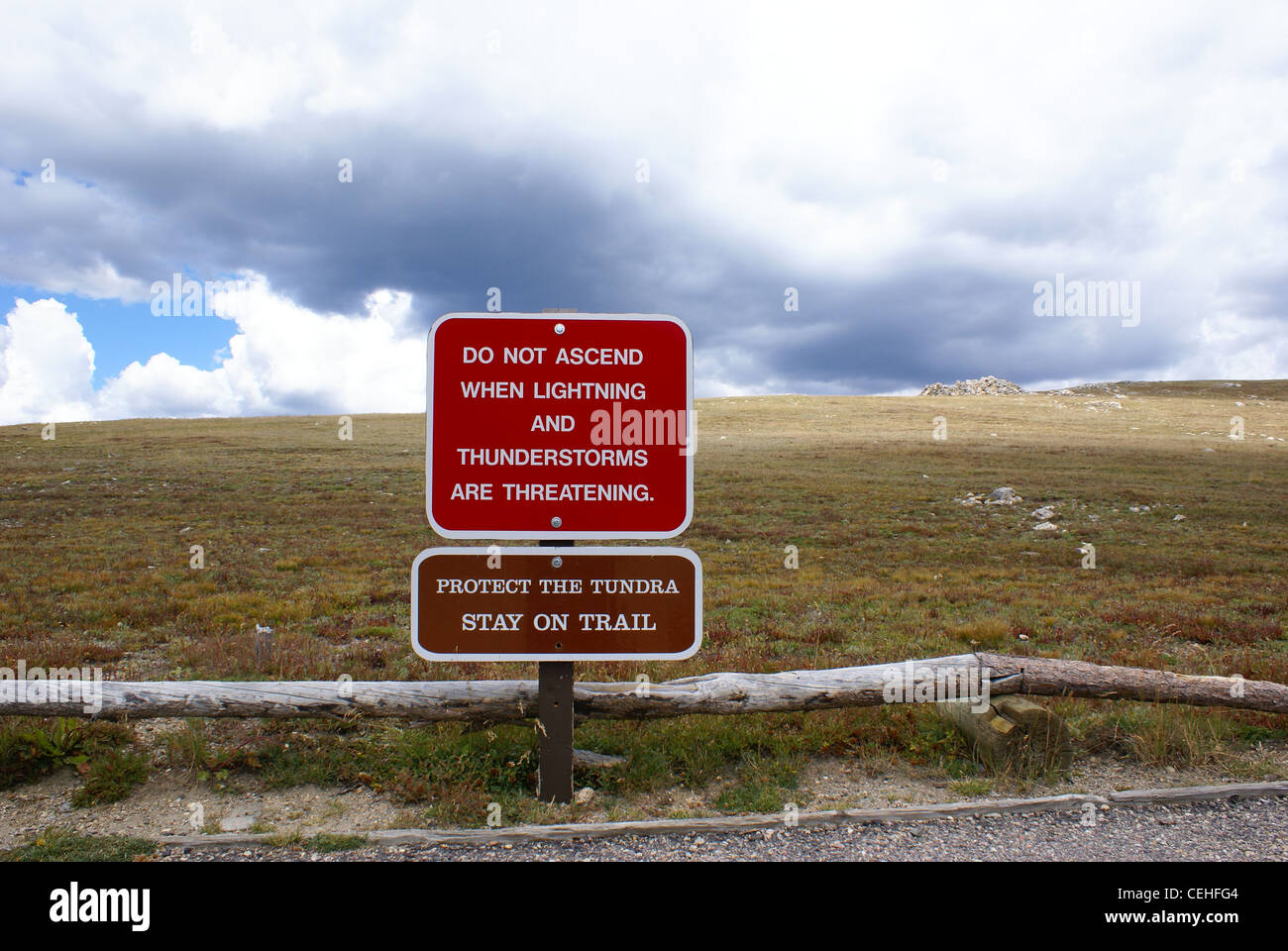Mountain sign warning of danger of lighting on trail Stock Photo - Alamy