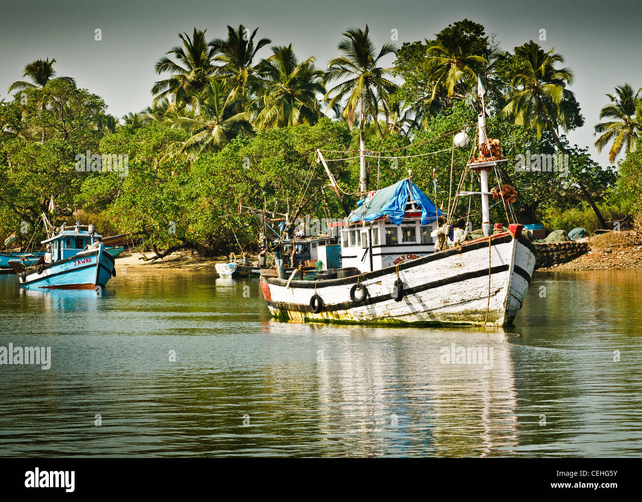 Fishing Trawlers on River Sal in Mobor, Goa, India Stock Photo - Alamy