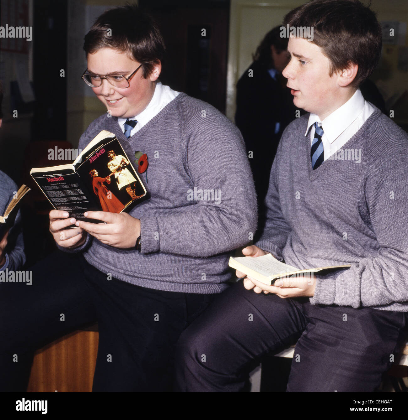 Teenage schoolboys reading Shakespeare's Macbeth book in a secondary ...