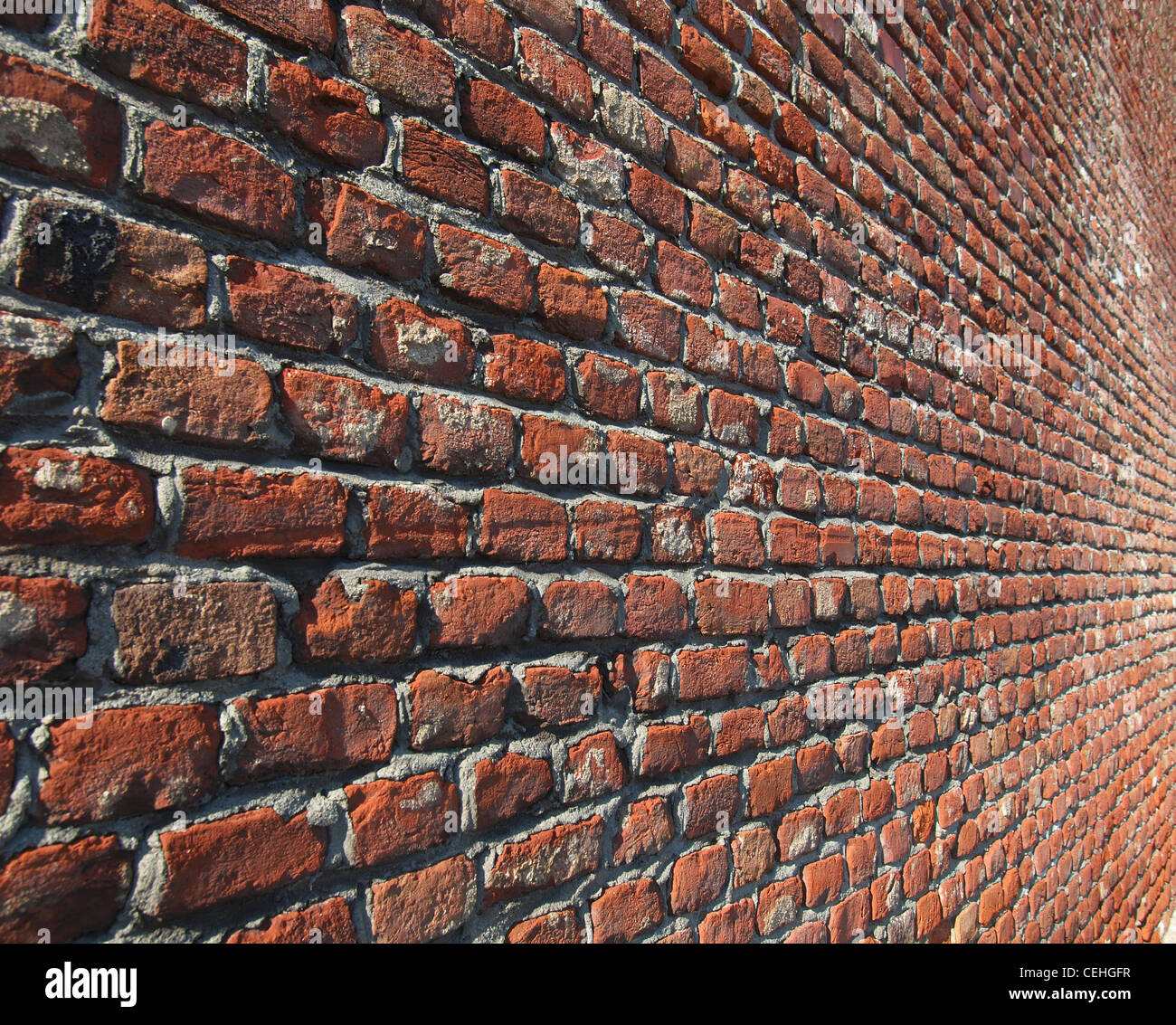 Red brick wall useful as a background - selective focus Stock Photo - Alamy
