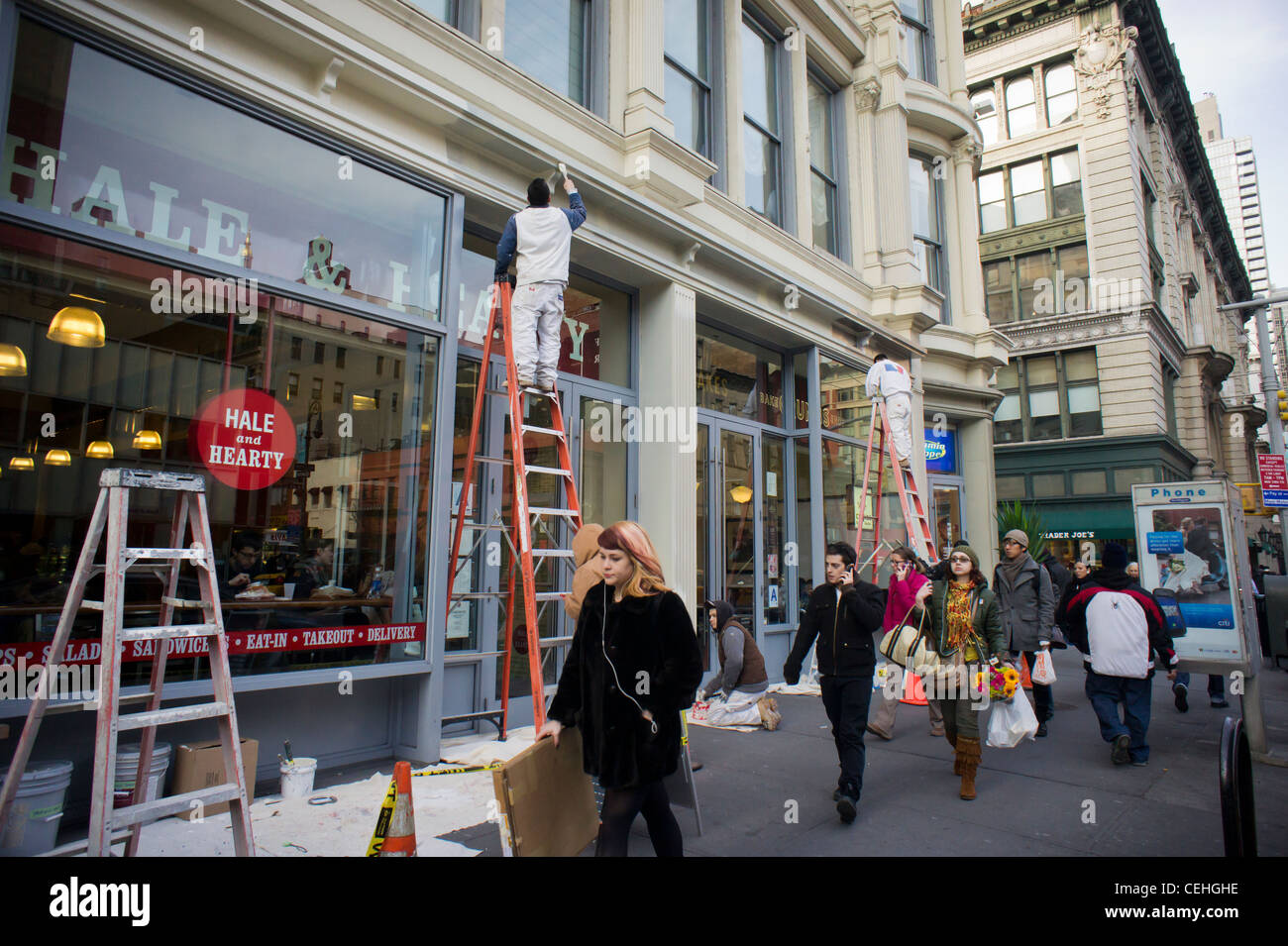 Hustle and bustle on a busy Friday afternoon on Sixth Avenue in the ...