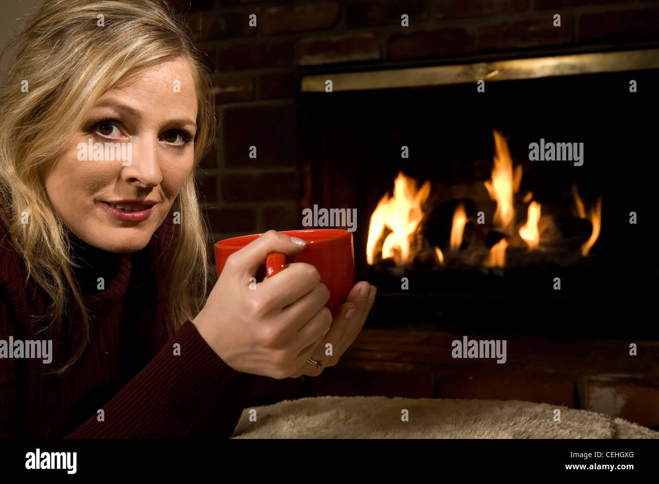 Warming by the fire inside hi-res stock photography and images - Alamy