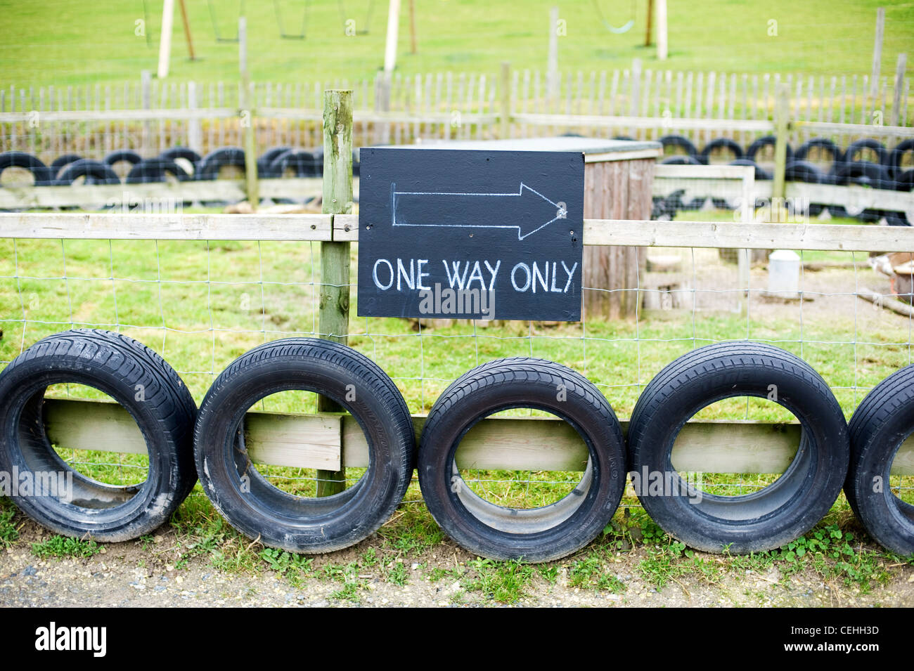'One Way Only' and an arrow sign at a go karting track in England Stock ...
