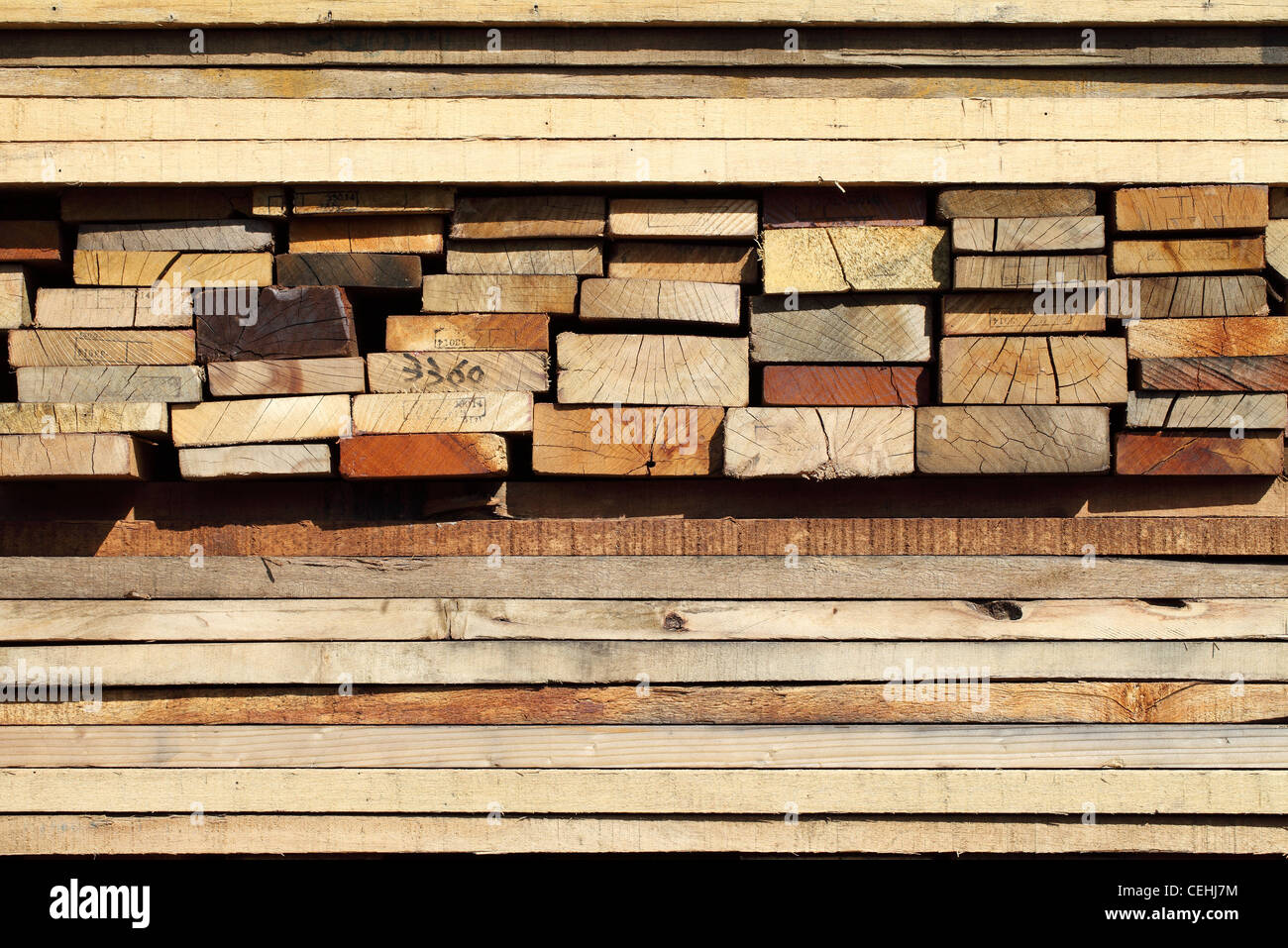 Stack of wood planks on lumber yard Stock Photo - Alamy