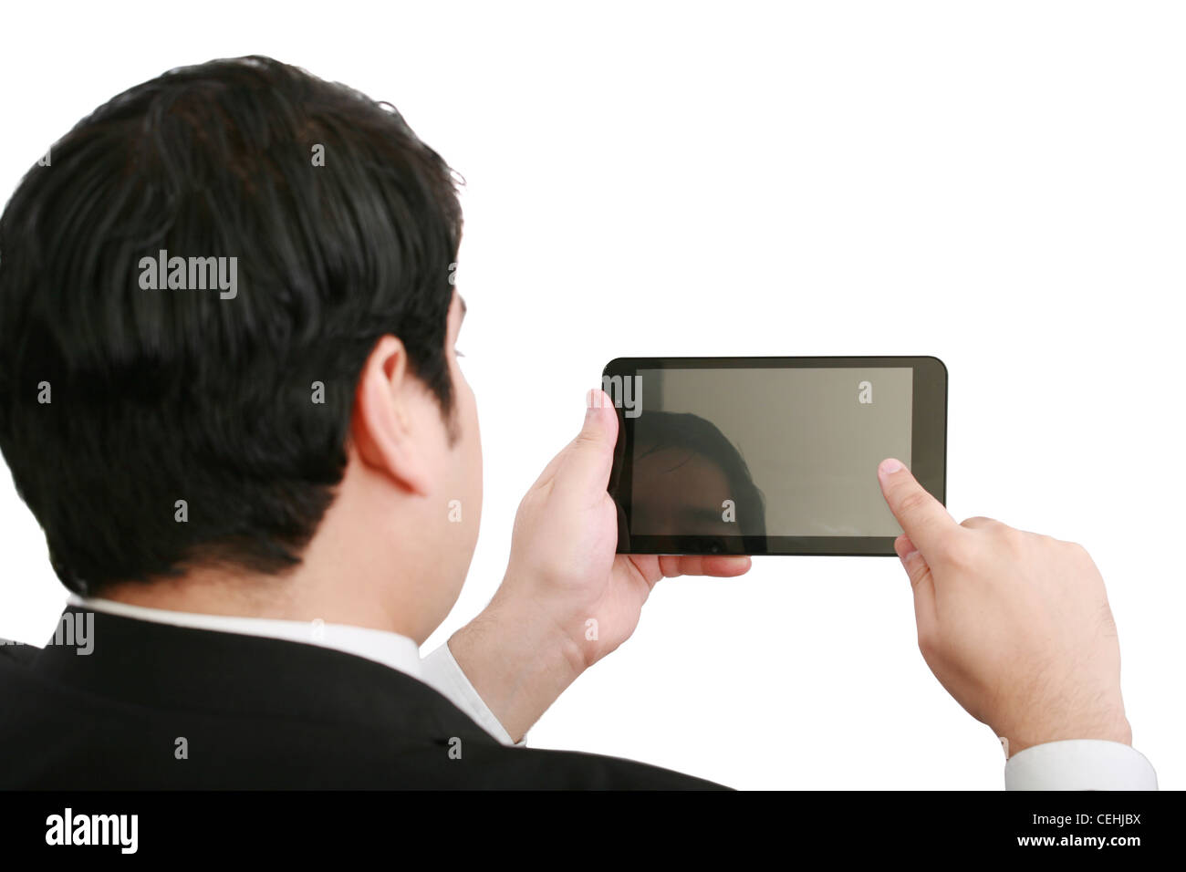 Businessman holding a blank touchpad pc, one finger touches the screen ...