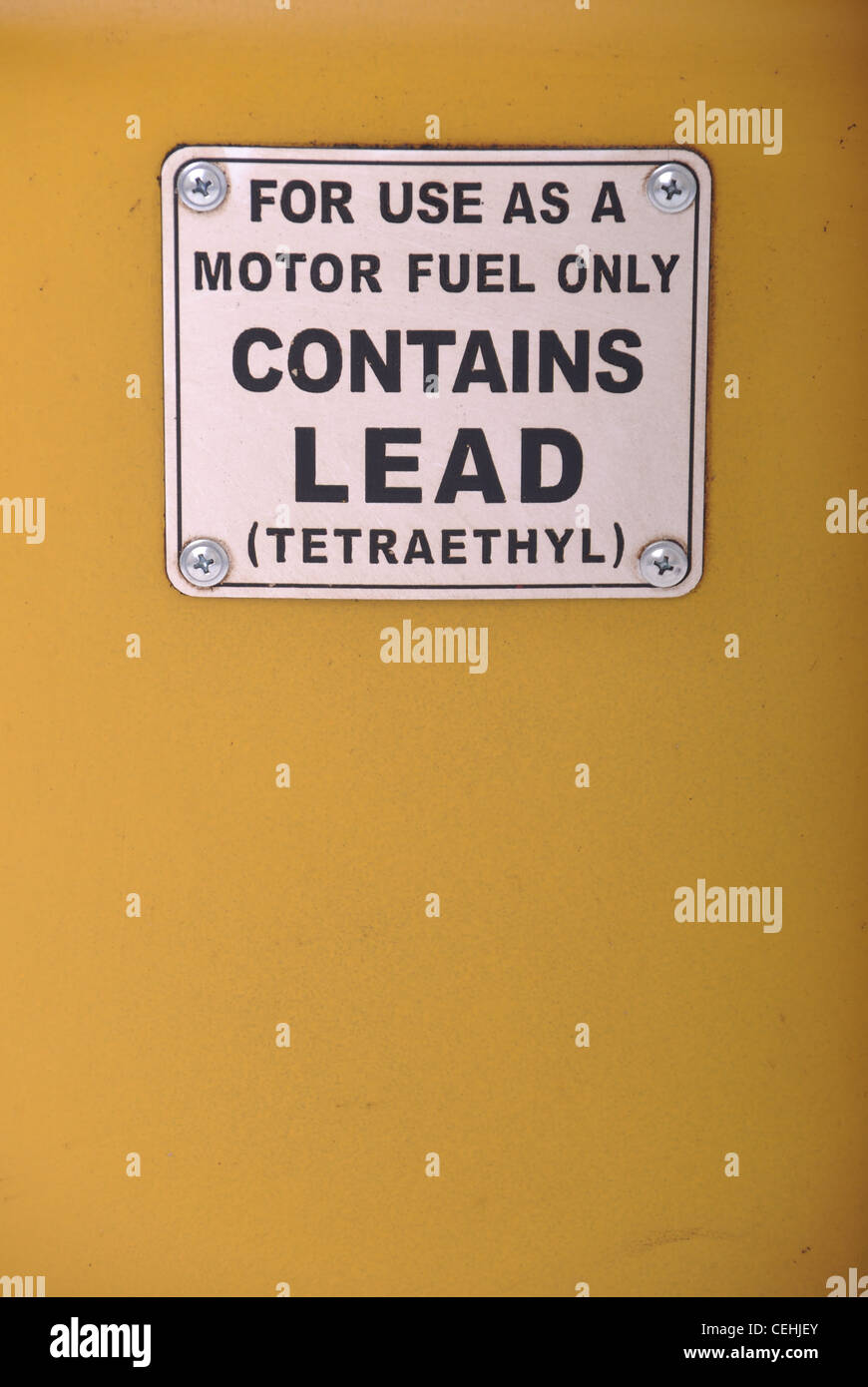 contains lead vintage sign on a yellow gas pump background Stock Photo ...