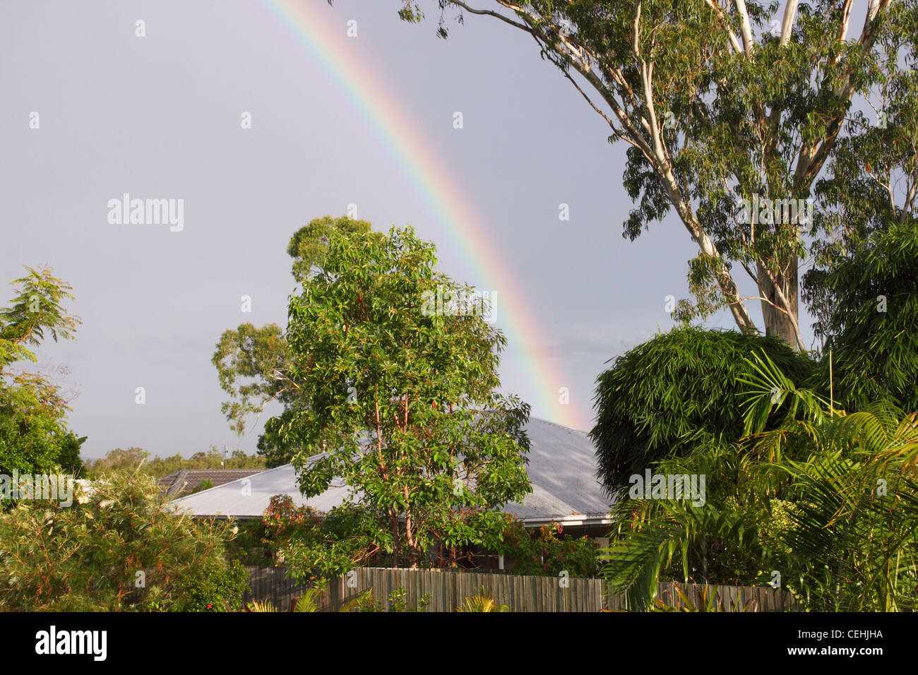 Rainbow following an afternoon storm in Australia Stock Photo - Alamy