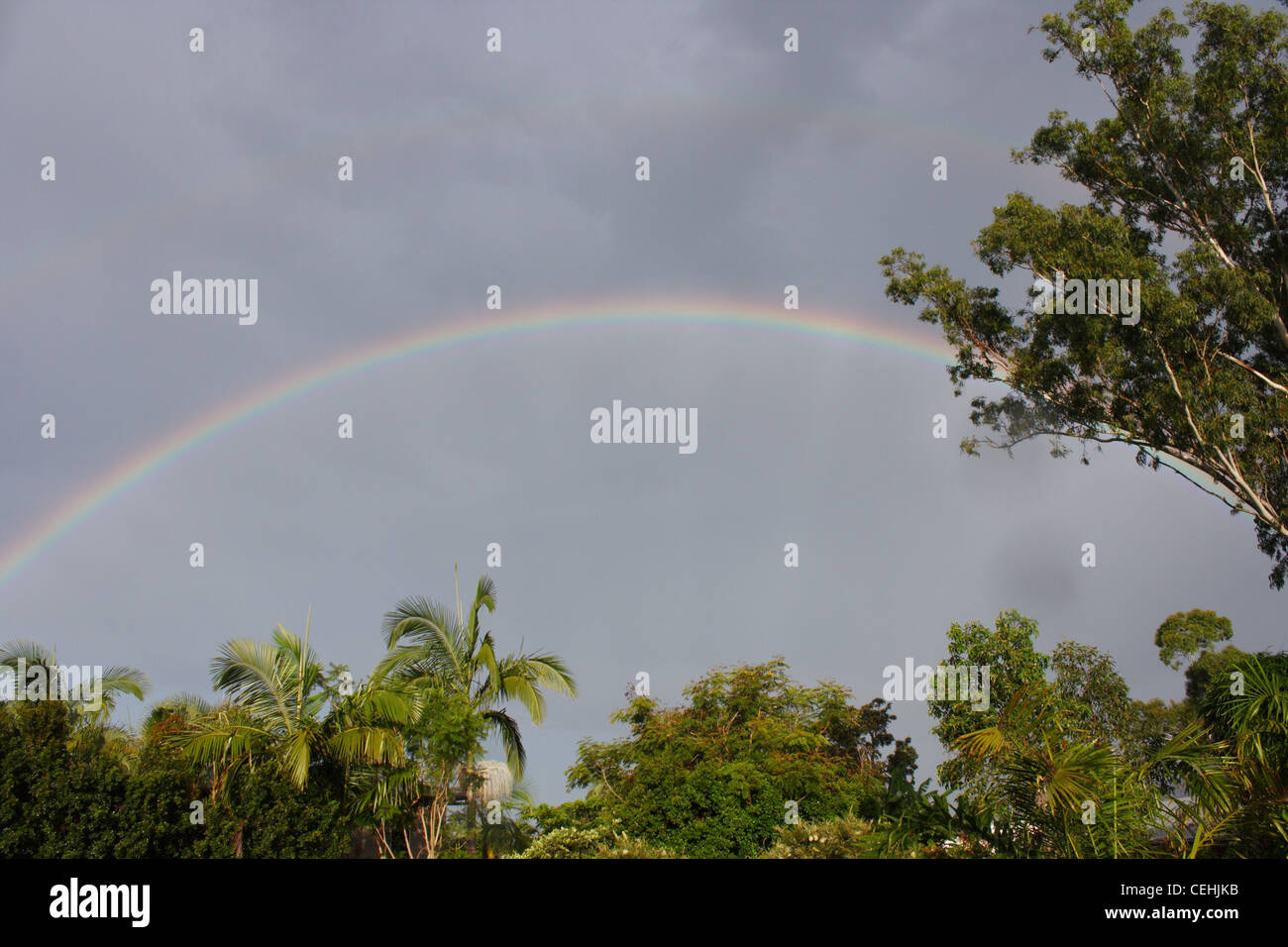 Rainbow following an afternoon storm in Australia Stock Photo - Alamy
