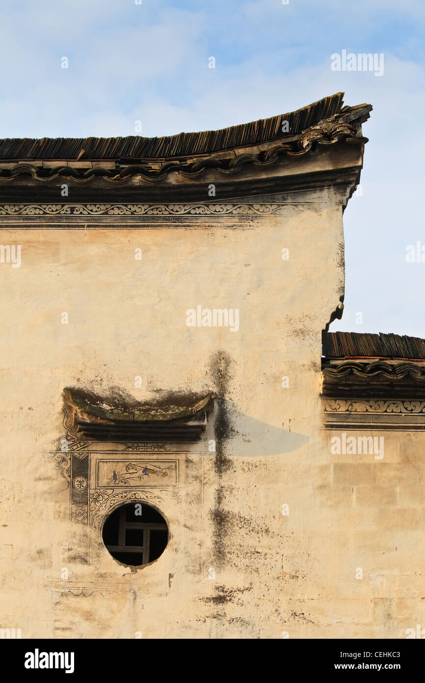 A Chinese Hui Style house with black roof tiles, white wall, and ...