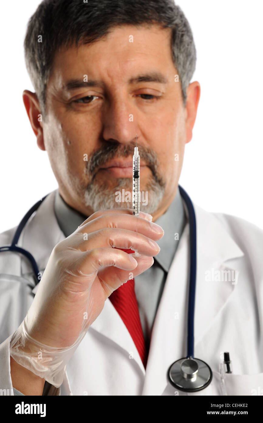 Hispanic doctor holding syringe Stock Photo - Alamy