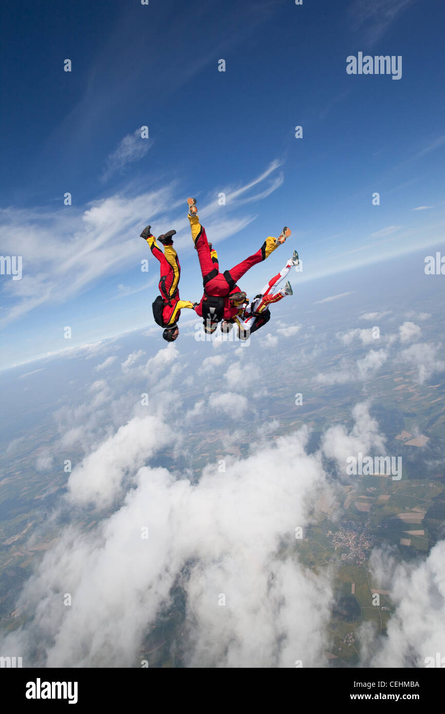 Skydiver team is flying in the sky free and building a head down ...