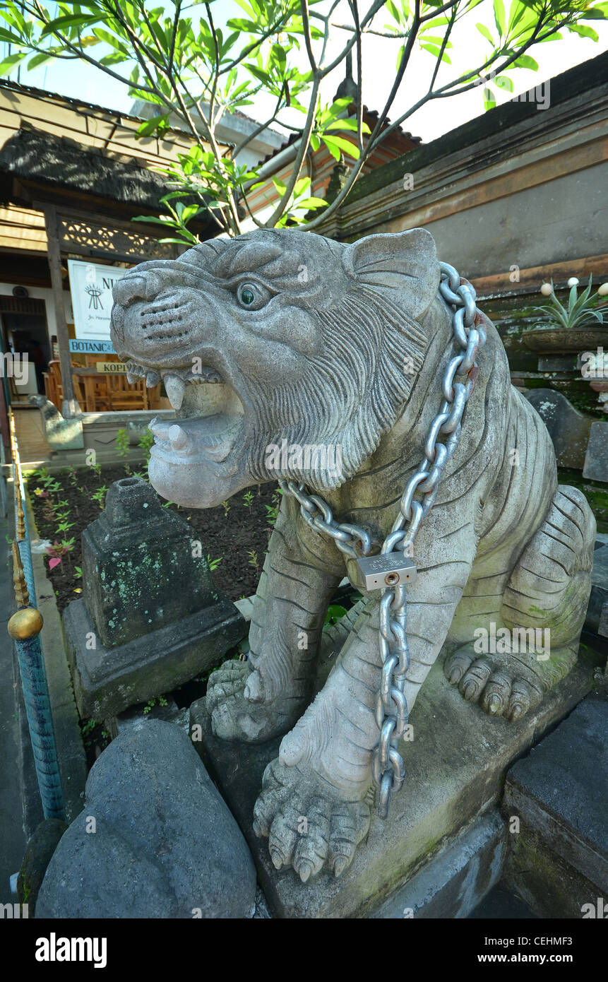 Chained stone statue depicting the tiger - companion to Shiva the Hindu ...