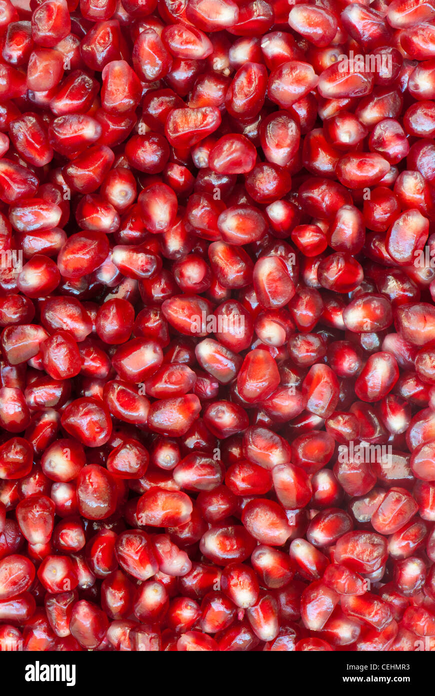 The pomegranate seeds red background Stock Photo - Alamy