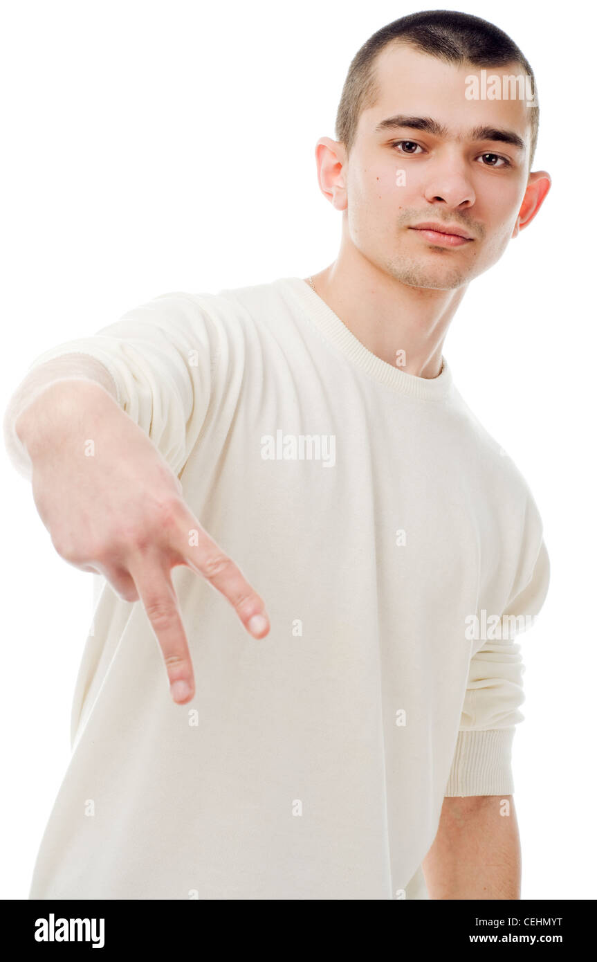 Young caucasian man showing sign with his fingers isolated on white ...