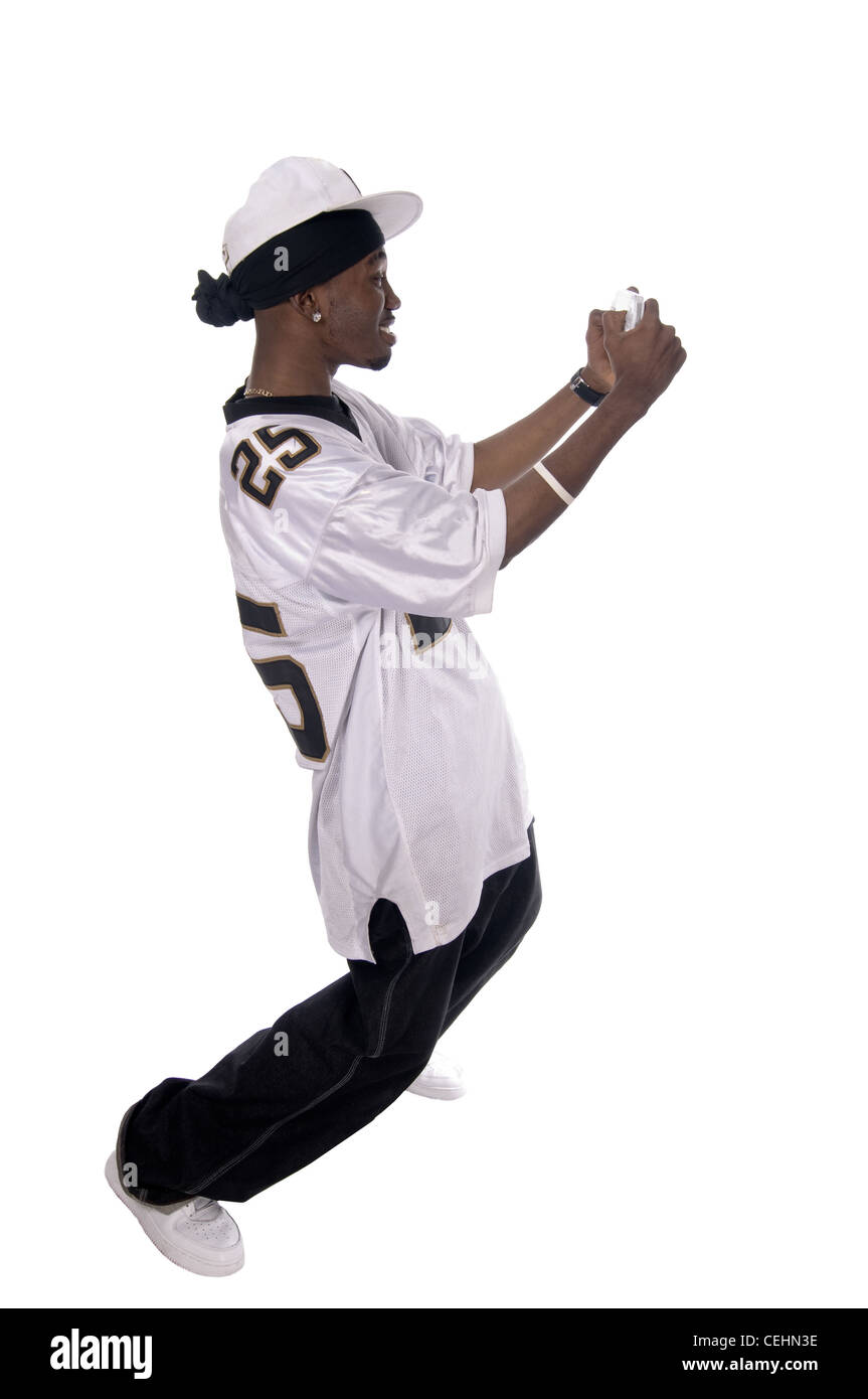 Cool young hip-hop dancer on white background Stock Photo - Alamy