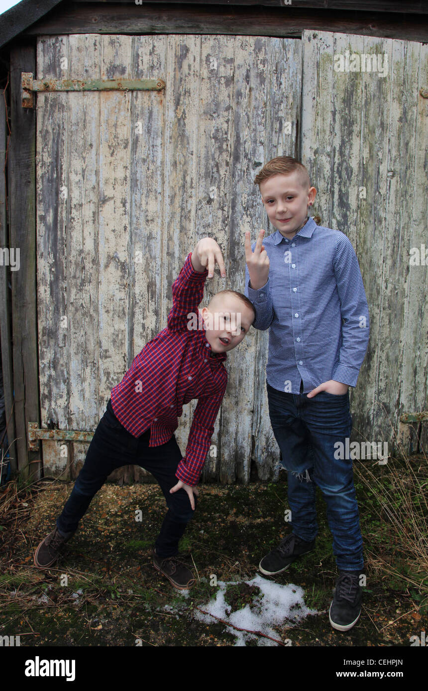 2 brothers posing outside Stock Photo - Alamy