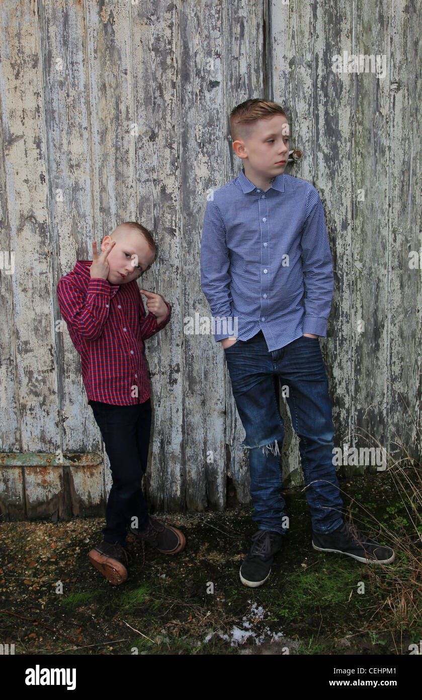 2 brothers posing outside Stock Photo - Alamy