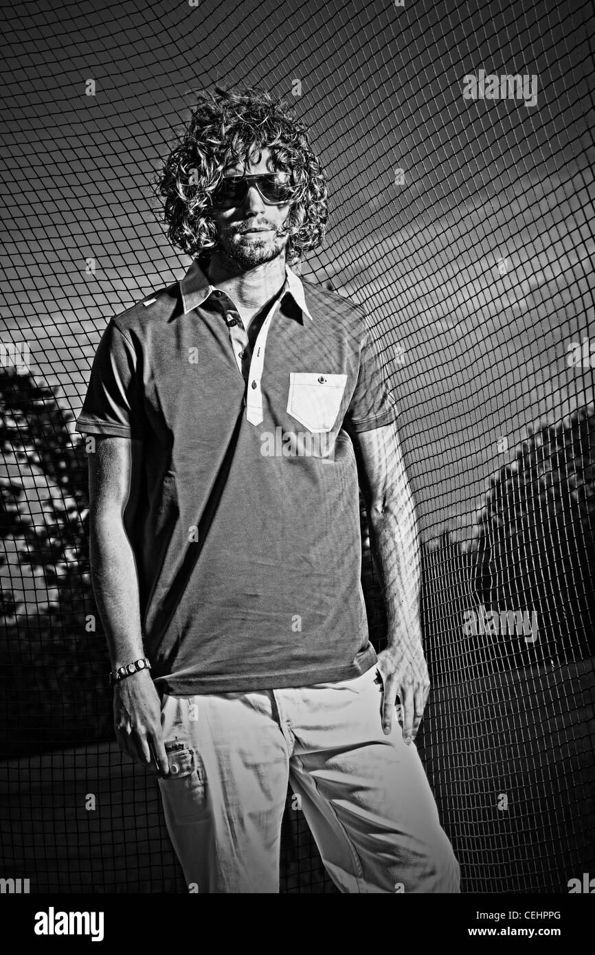 A black and white and colour photograph of a white,male age 20-25 ...