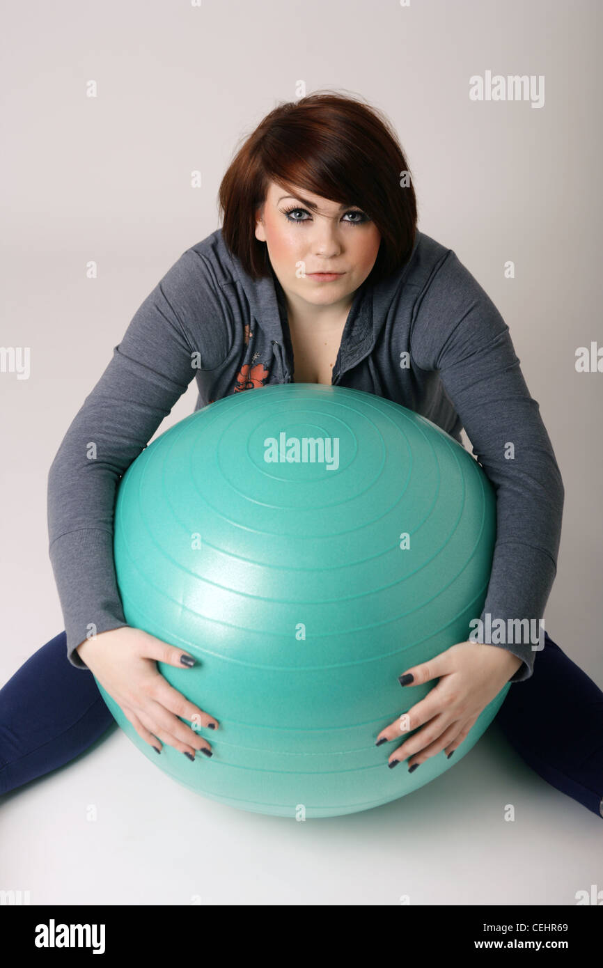 Woman hugging exercise ball hi-res stock photography and images - Alamy