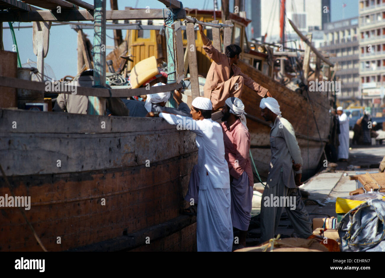 Dubai UAE Men Working Talking By Dhows Stock Photo - Alamy