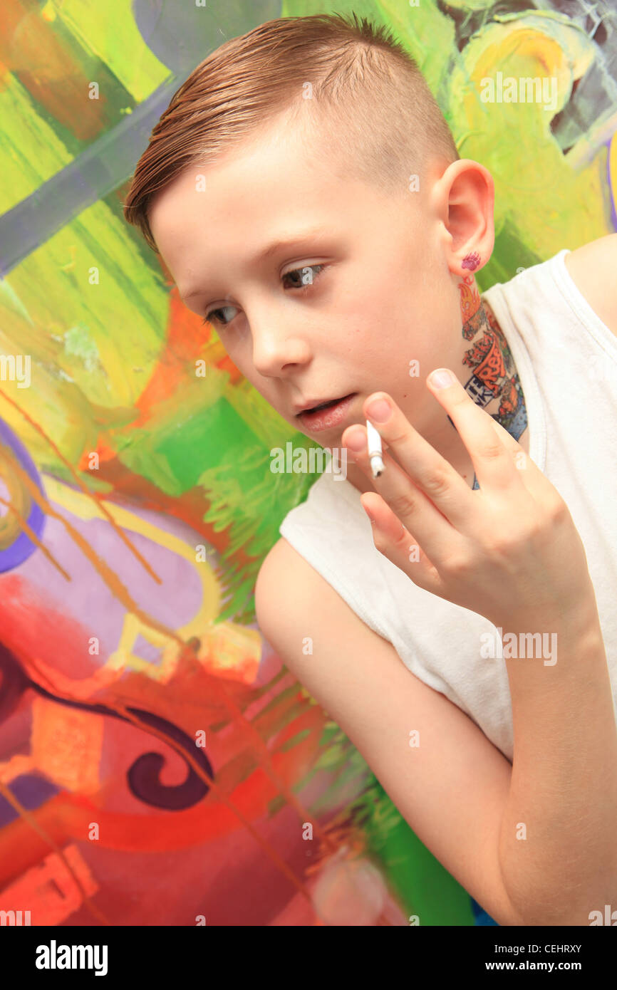 8 -9 yr old boy smoking Stock Photo - Alamy