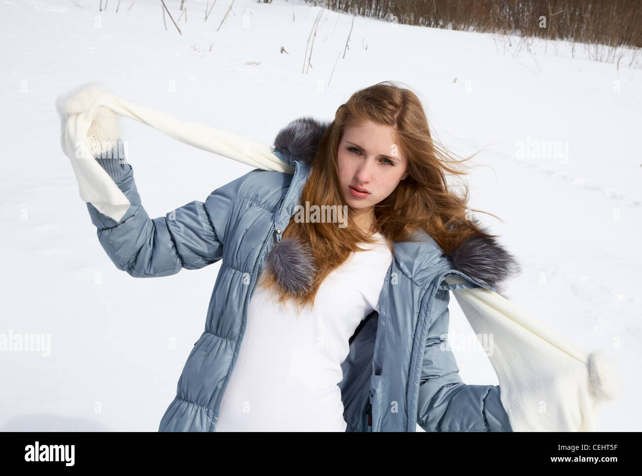 The beautiful girl against tree in the winter afternoon Stock Photo - Alamy