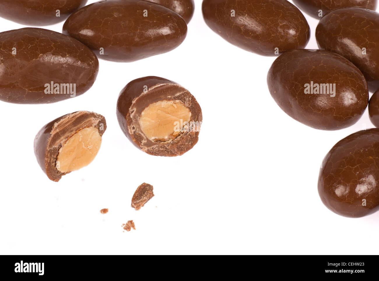 Crunchy almonds dipped in black chocolate Stock Photo - Alamy