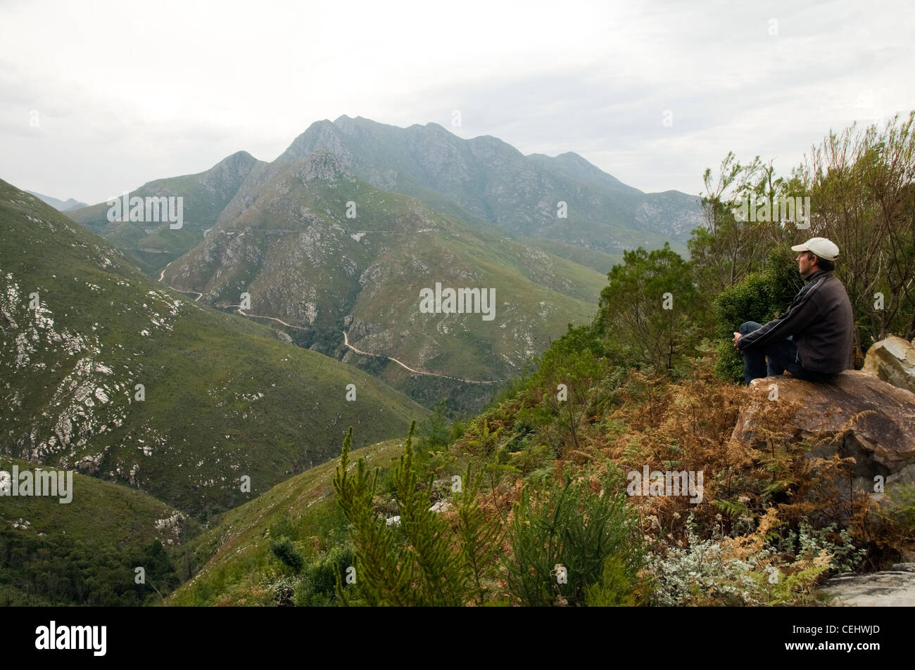 Tourist resting looking out over Prince Albert Pass,Western Cape ...