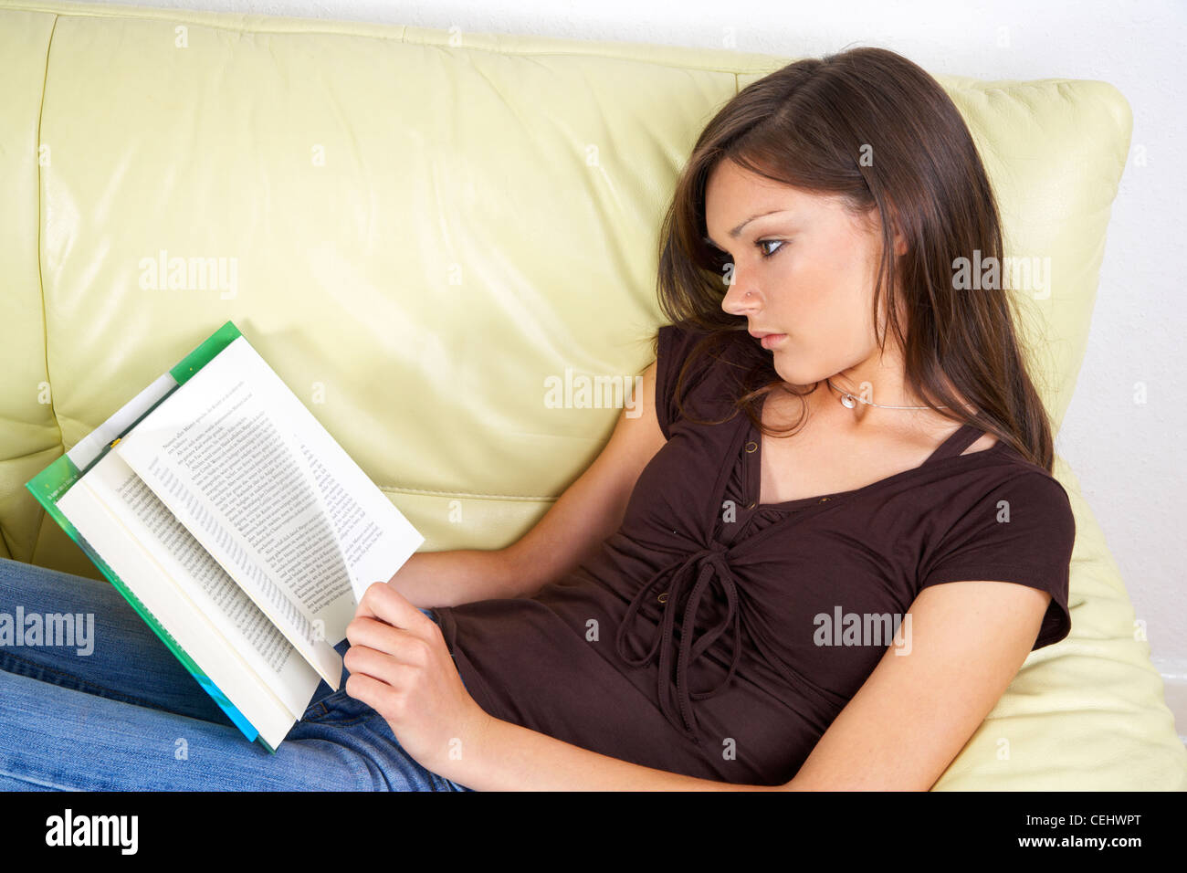 Girl reading a book Stock Photo - Alamy