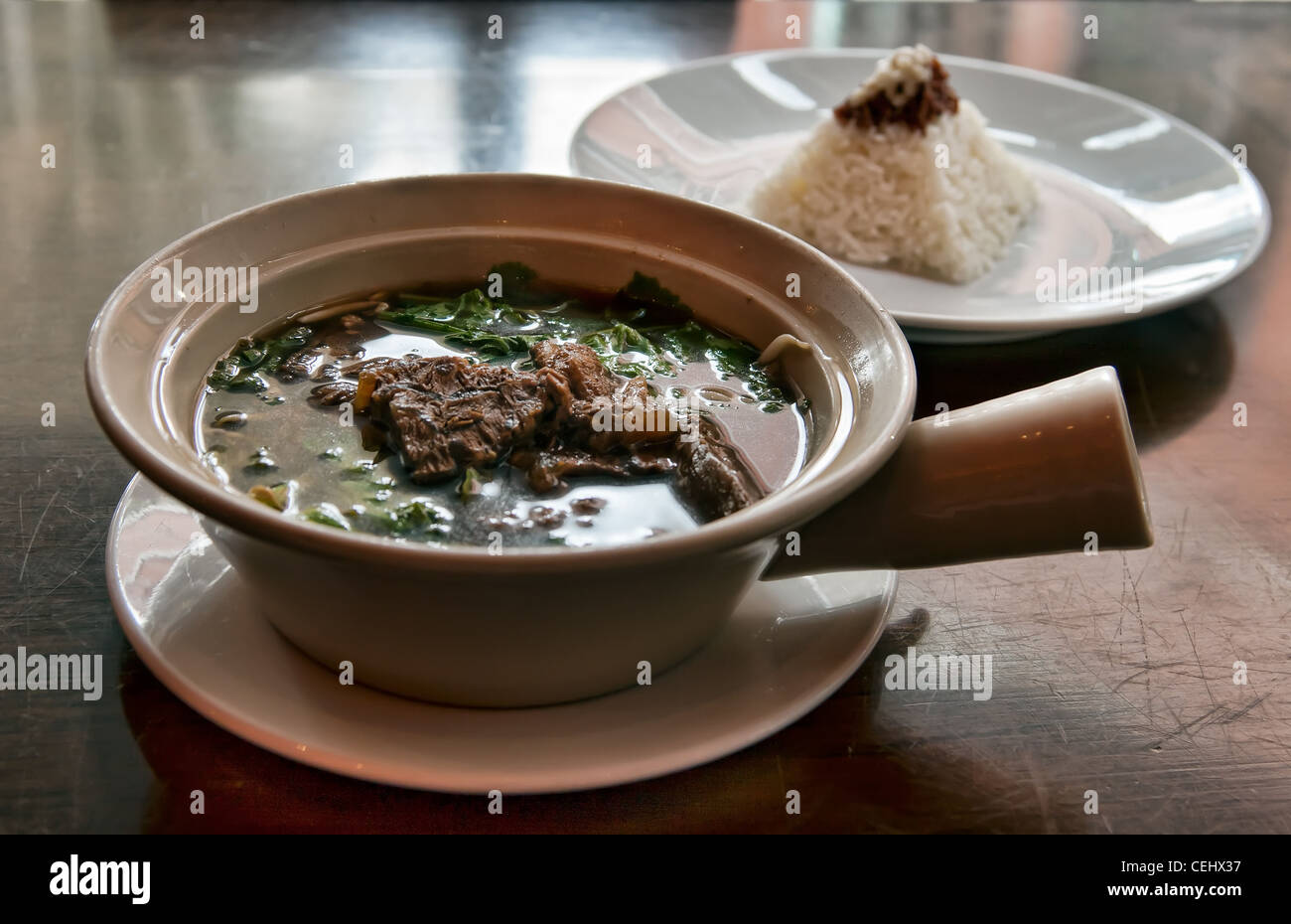 bowl of soup with meat and rice packed pyramid Stock Photo - Alamy