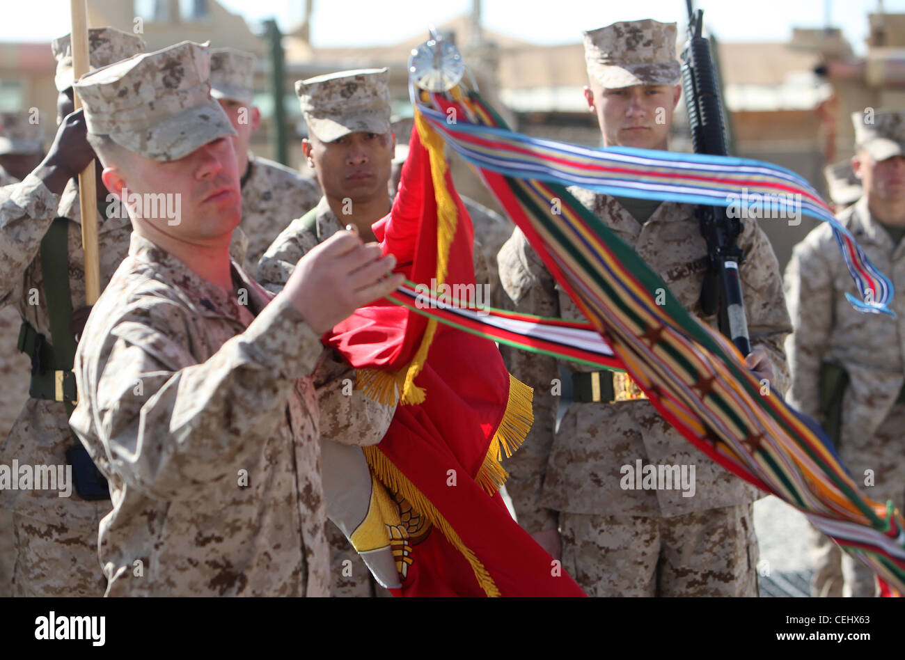 Sgt. Harry Pickett, of Tacoma, Wash., attaches the Afghanistan Campaign ...