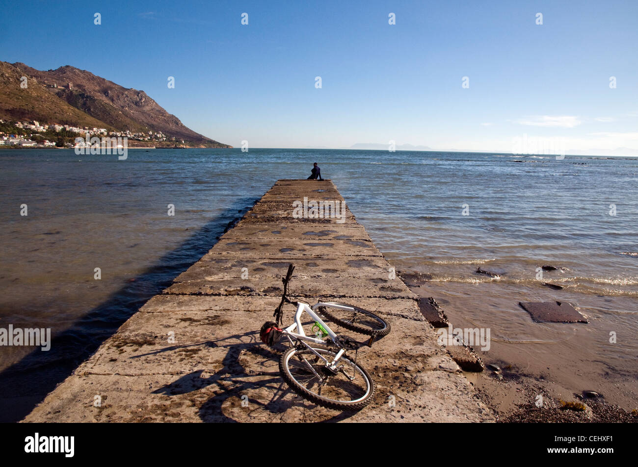 Man sitting on pier,Gordon's Bay,Western Cape Province Stock Photo - Alamy