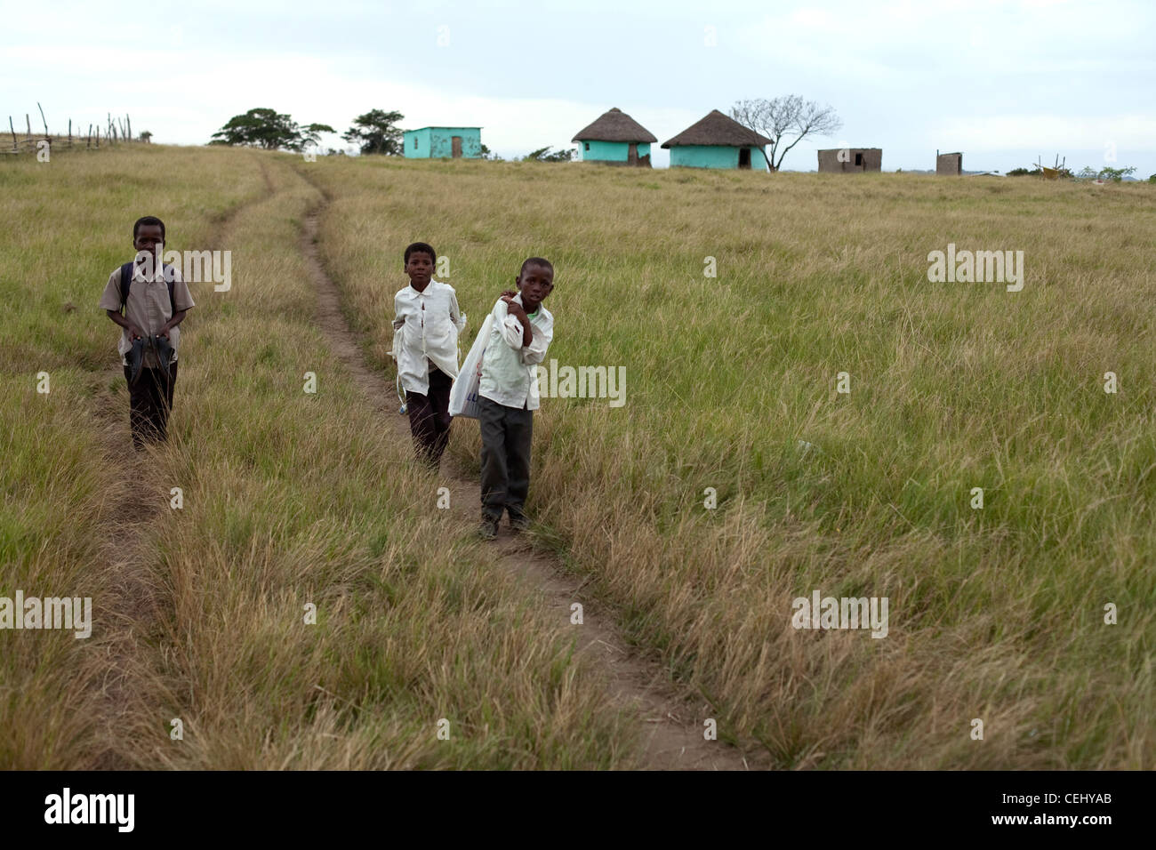 Rural school children walking africa hi-res stock photography and ...