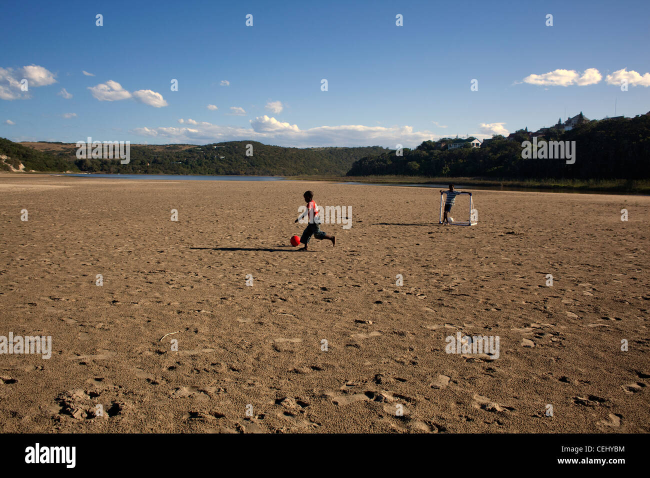 Kids playing beach soccer hi-res stock photography and images - Alamy