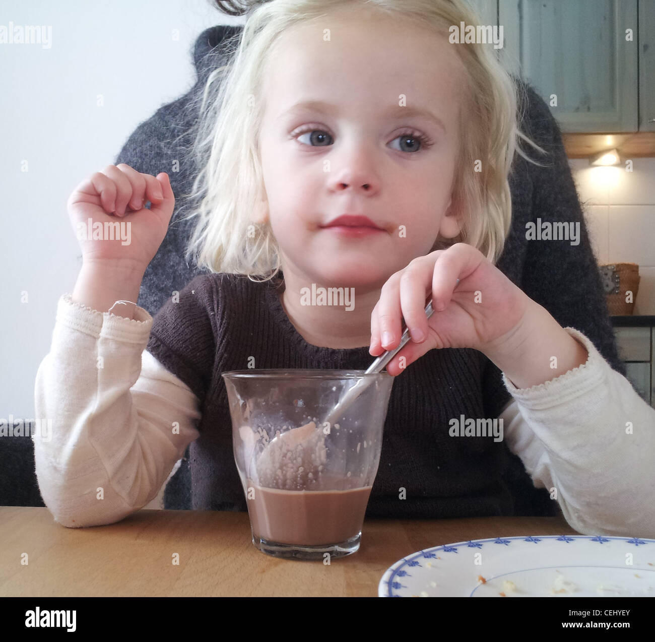 little child feasting cocolade milk Stock Photo - Alamy