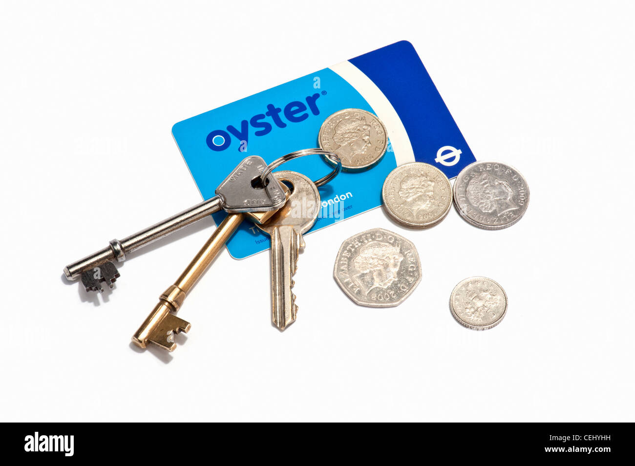 An Oyster card, keys and British coins Stock Photo - Alamy