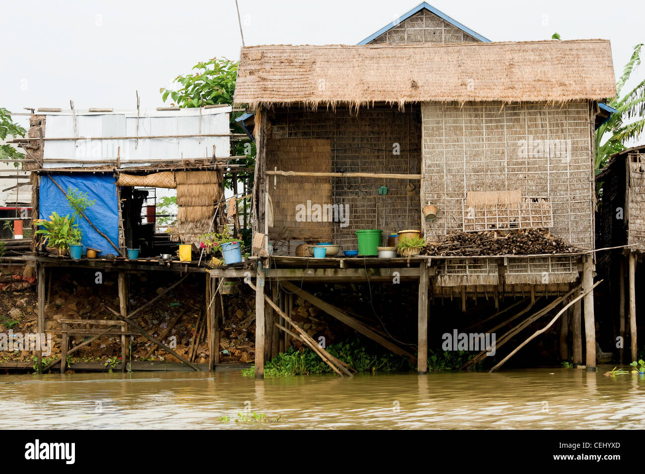 Traditional fishermen wooden houses on stilts. Tonle Sap Lake in ... Traditional fishermen wooden houses on stilts. Tonle Sap Lake in ...