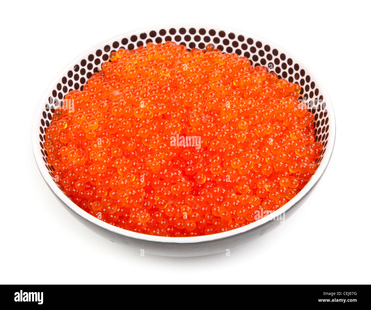 A plate full of fresh red caviar on white background Stock Photo - Alamy