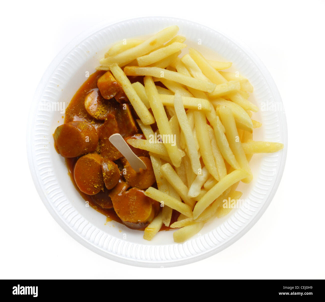 Nutrition, fast food. French fries with a curry wurst, a Bratwurst style sausage with a spicy ...