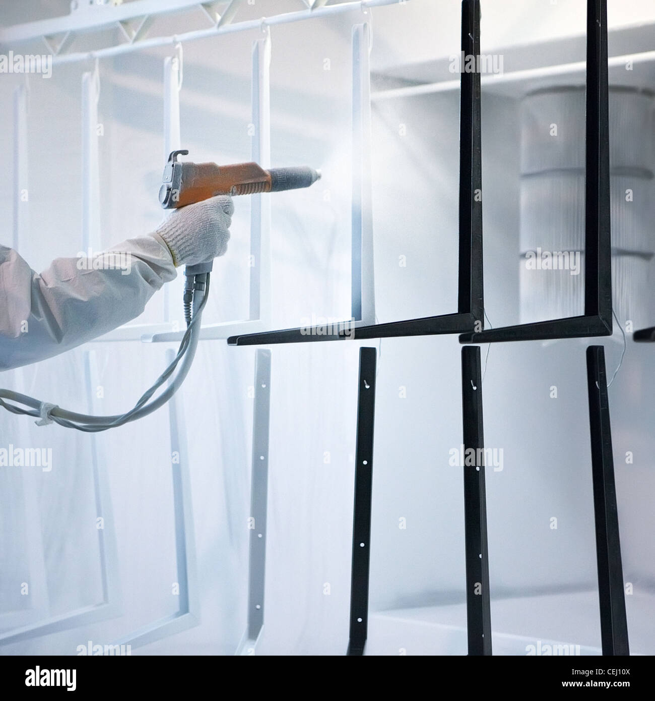 Hand holding powder coating sprayer Stock Photo - Alamy