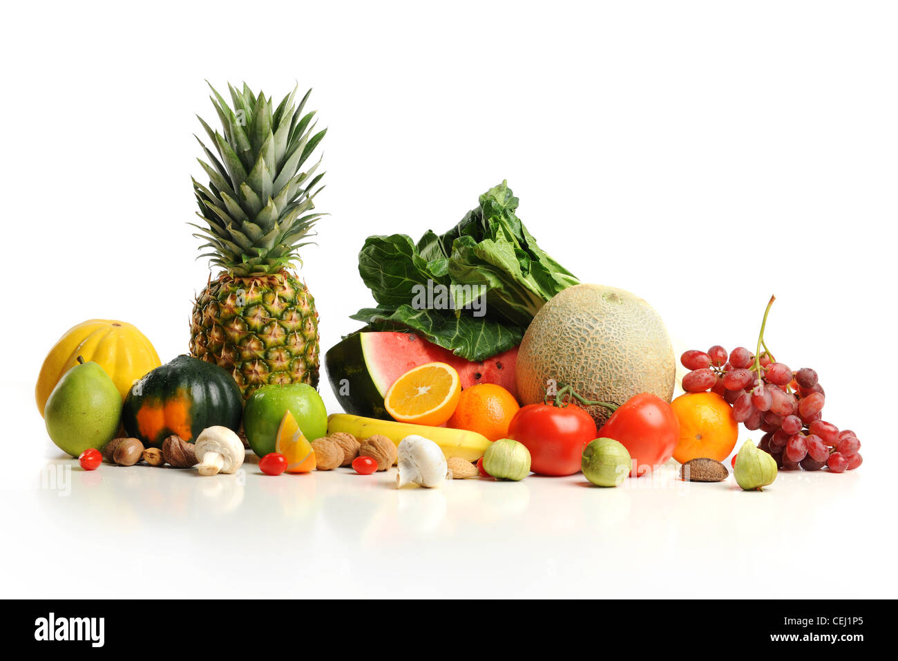 Colorful fruits arranged in a group isolated on a white background ...