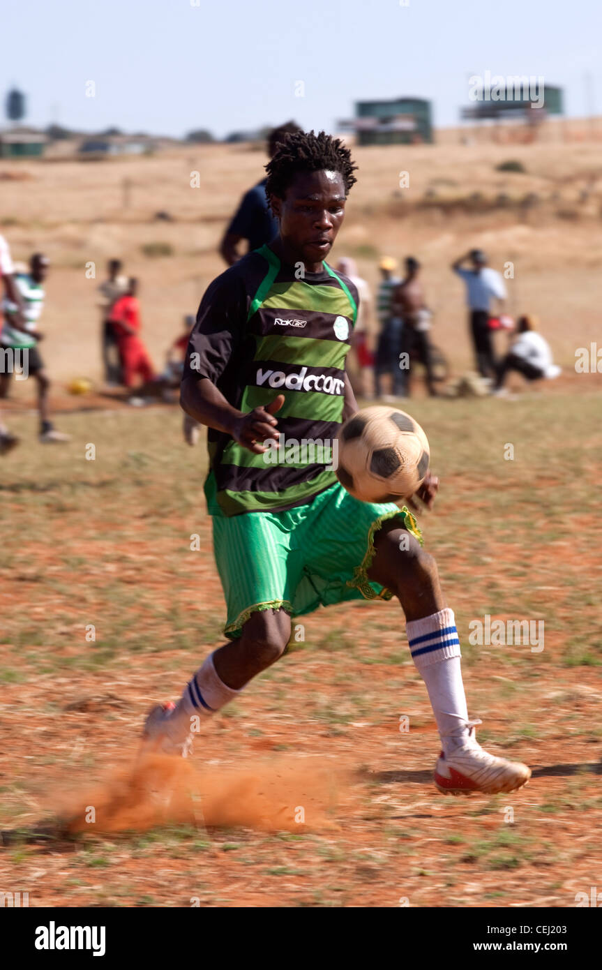 Soccer players on dusty rural field, outside Bloemfontein, Free State ...