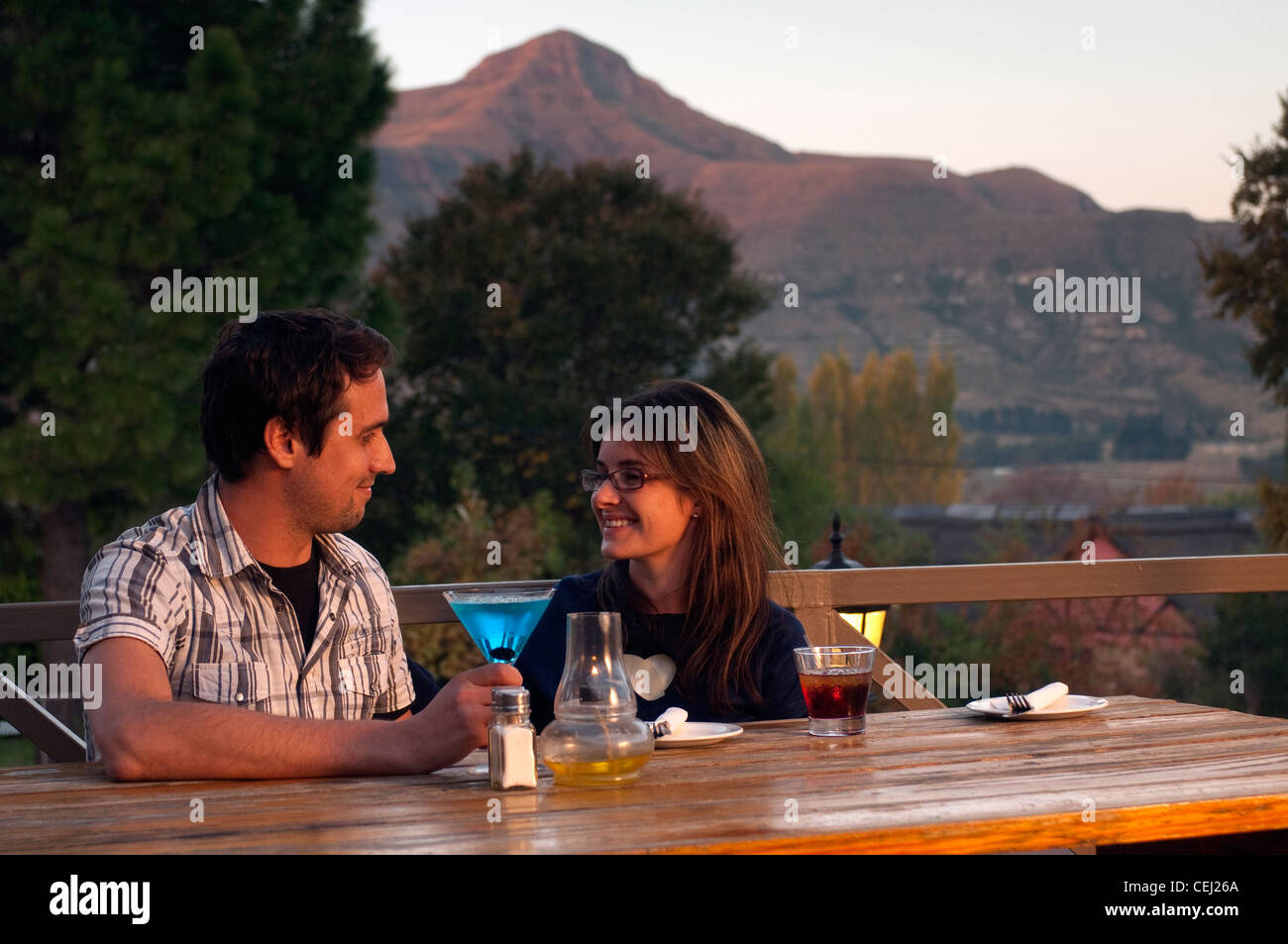 Couple having sundowners at a restaurant,Clarens,Eastern Free State ...