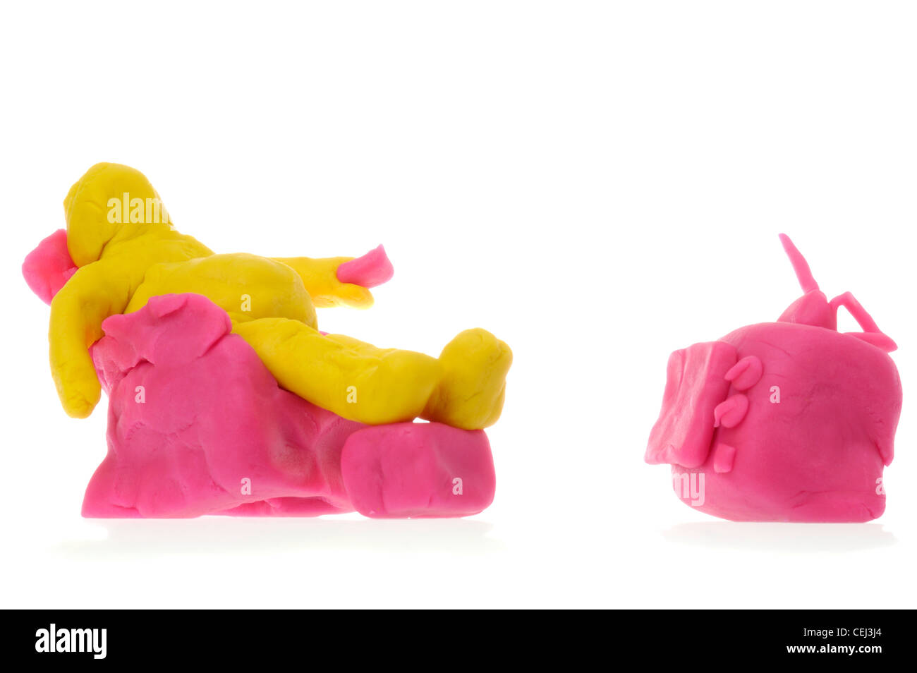 Clay man with remote control, watching TV Stock Photo - Alamy