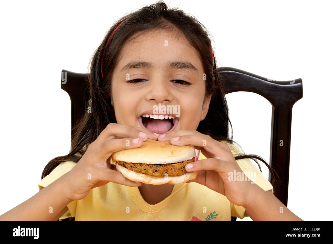 a girl eating Stock Photo - Alamy