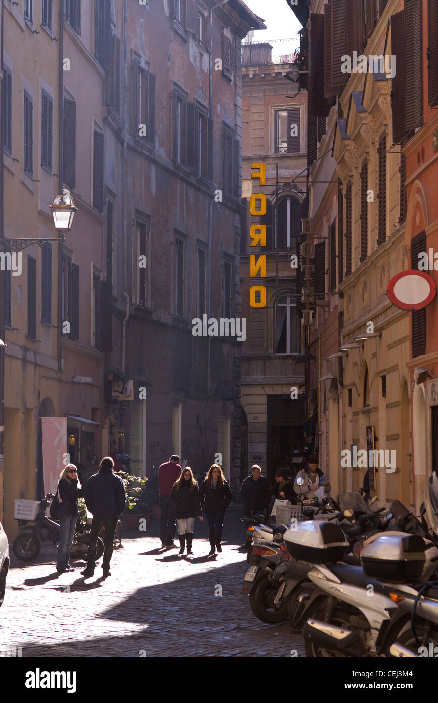A hazy side street near Campo De' Fiori with visitors walking and ...