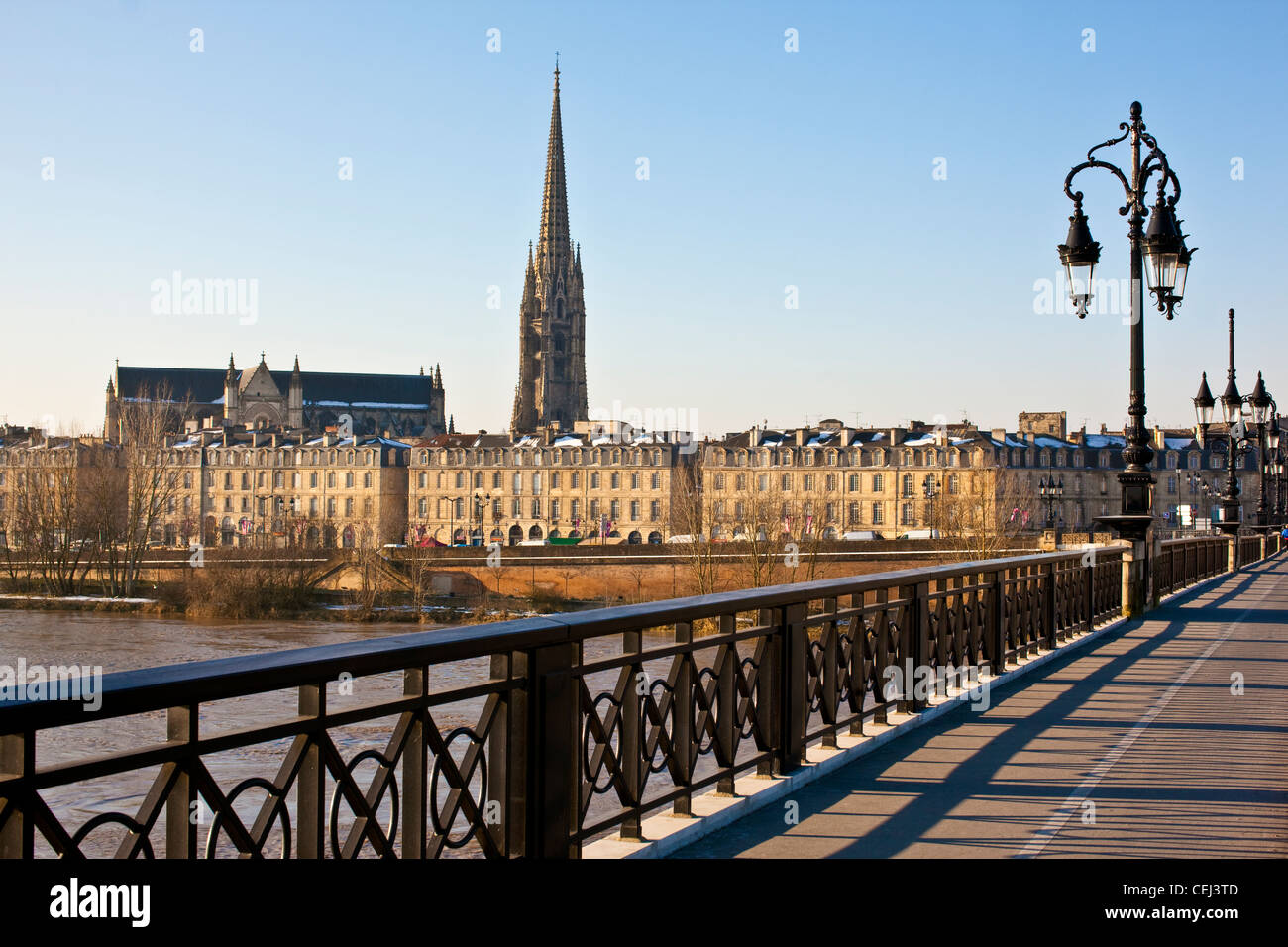 Pont de Pierre bridge crossing La Garonne River, with St Michel Tower ...