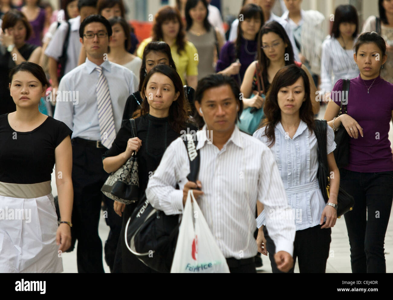 Commuters make their way to work in the central business district of ...